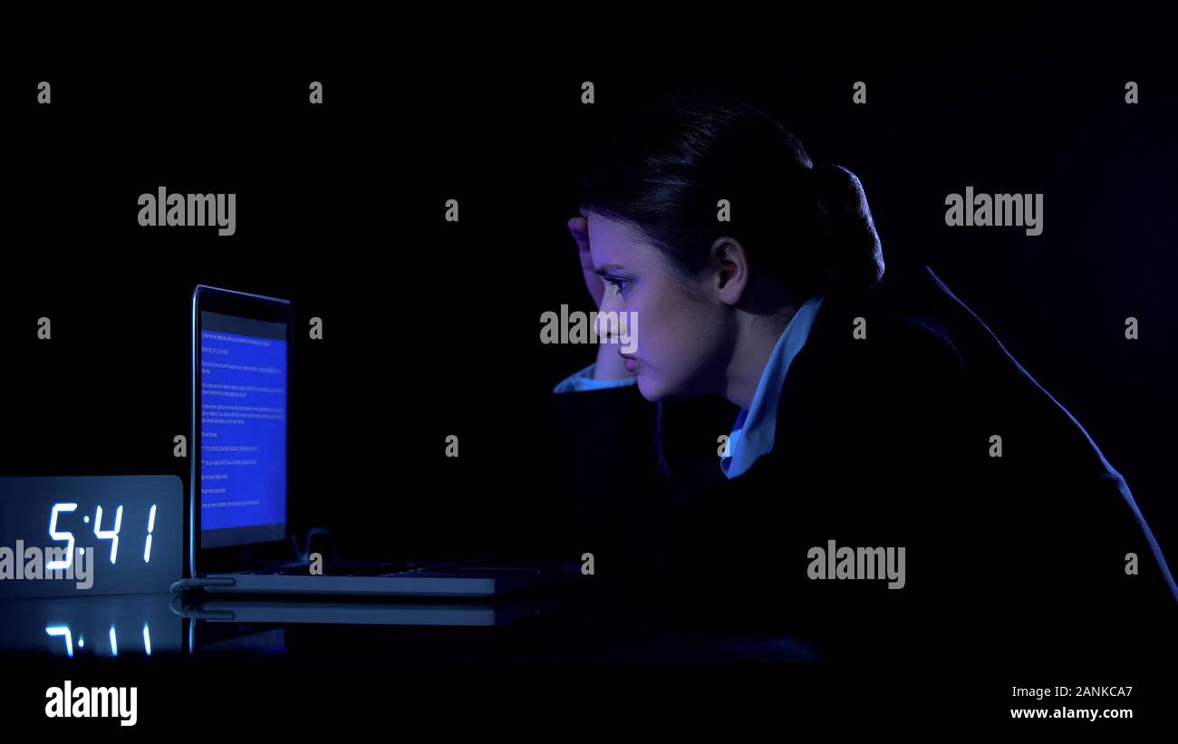 Upset businesslady looking at laptop death screen, software malfunction ...