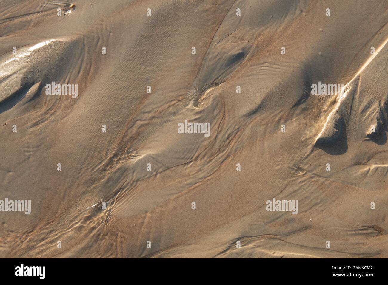 Wave ripples over wet sand hi-res stock photography and images - Alamy