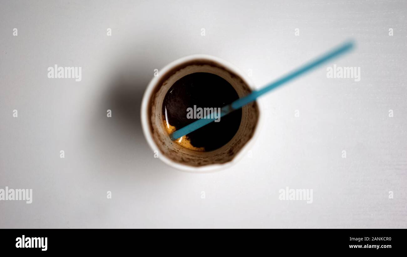 Disposable paper coffee cup with straw standing on white background ...