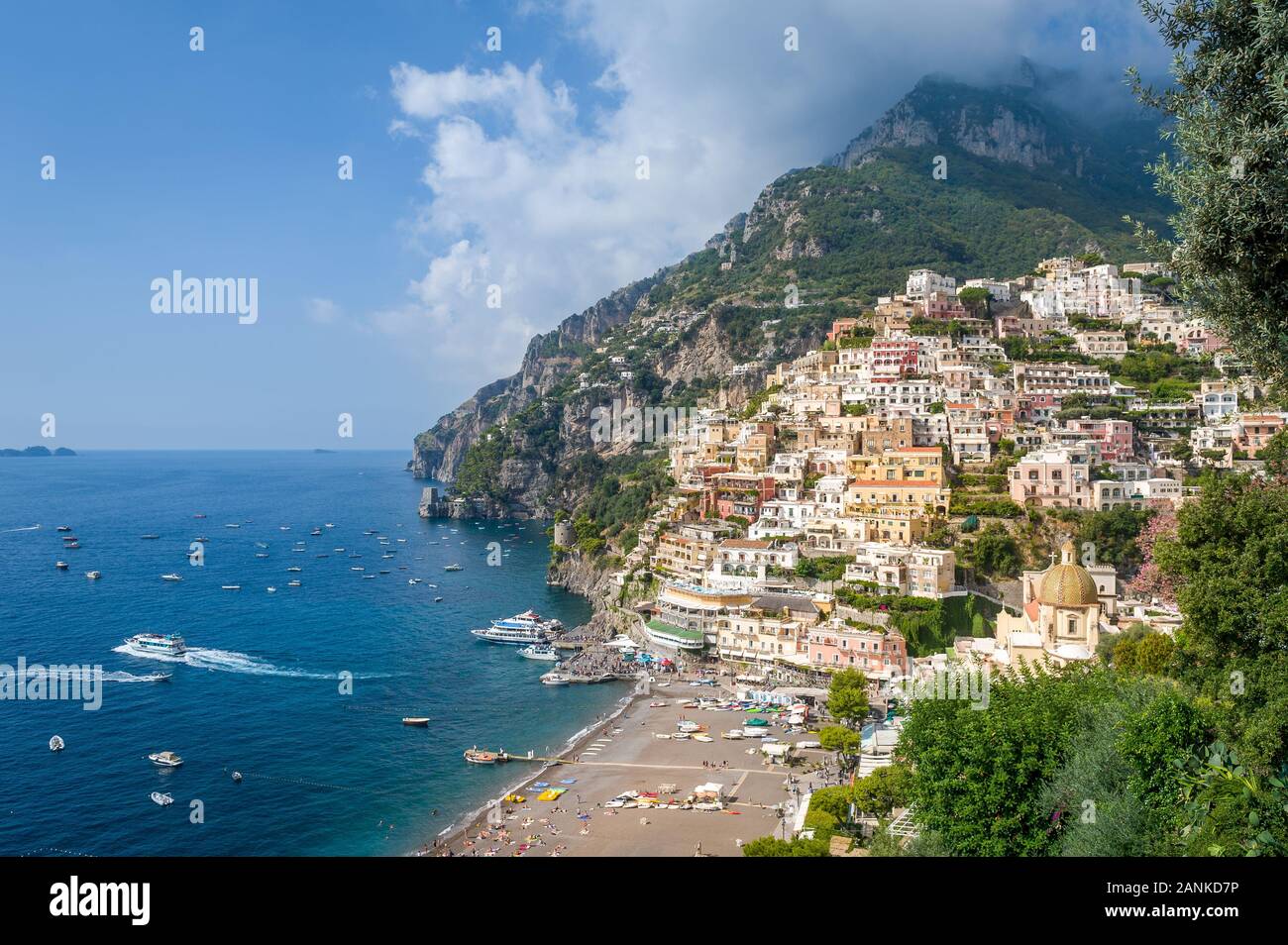 Postcard view of Positano village on the hills and mountain background ...