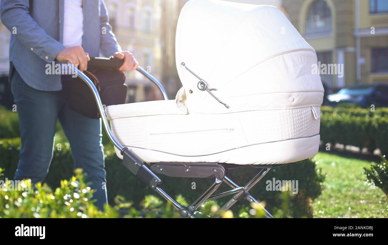 Man pushing child in pushchair hi-res stock photography and images - Alamy