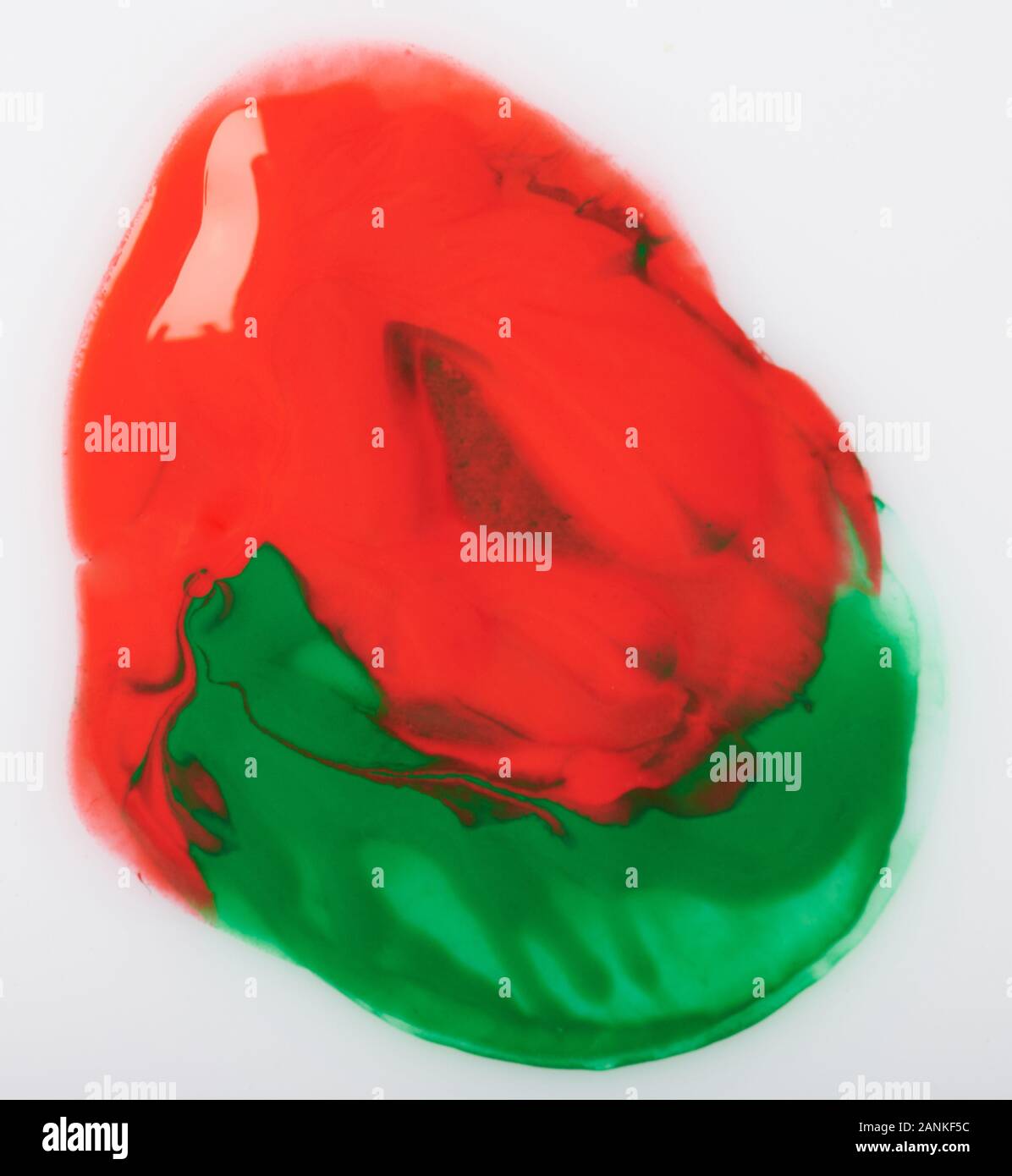 Paint drop of red and green color isolated on white paper background ...