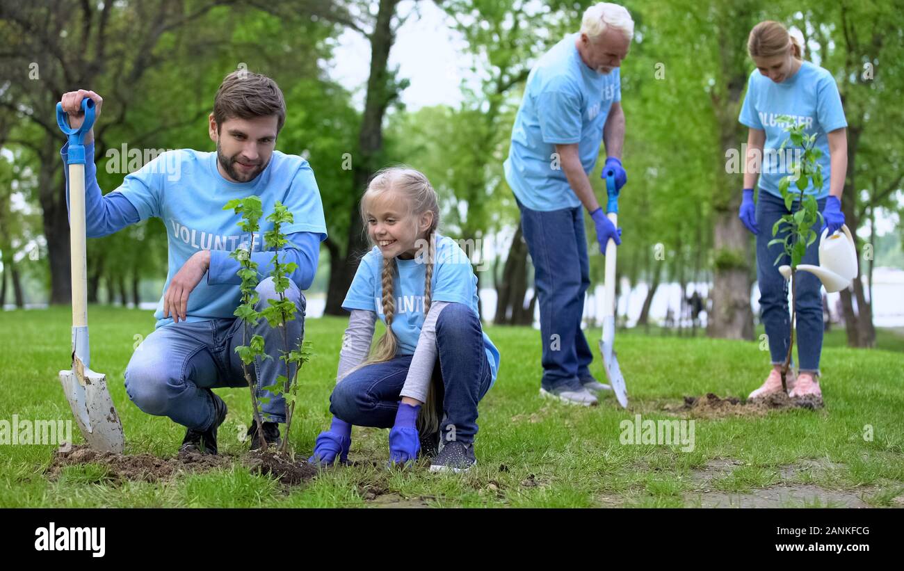 Family planting tree hi-res stock photography and images - Alamy