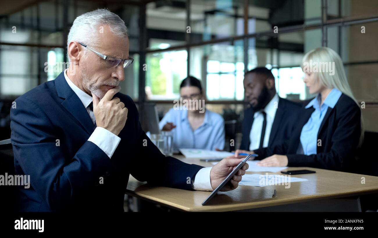 Mature businessman thinking hi-res stock photography and images - Alamy
