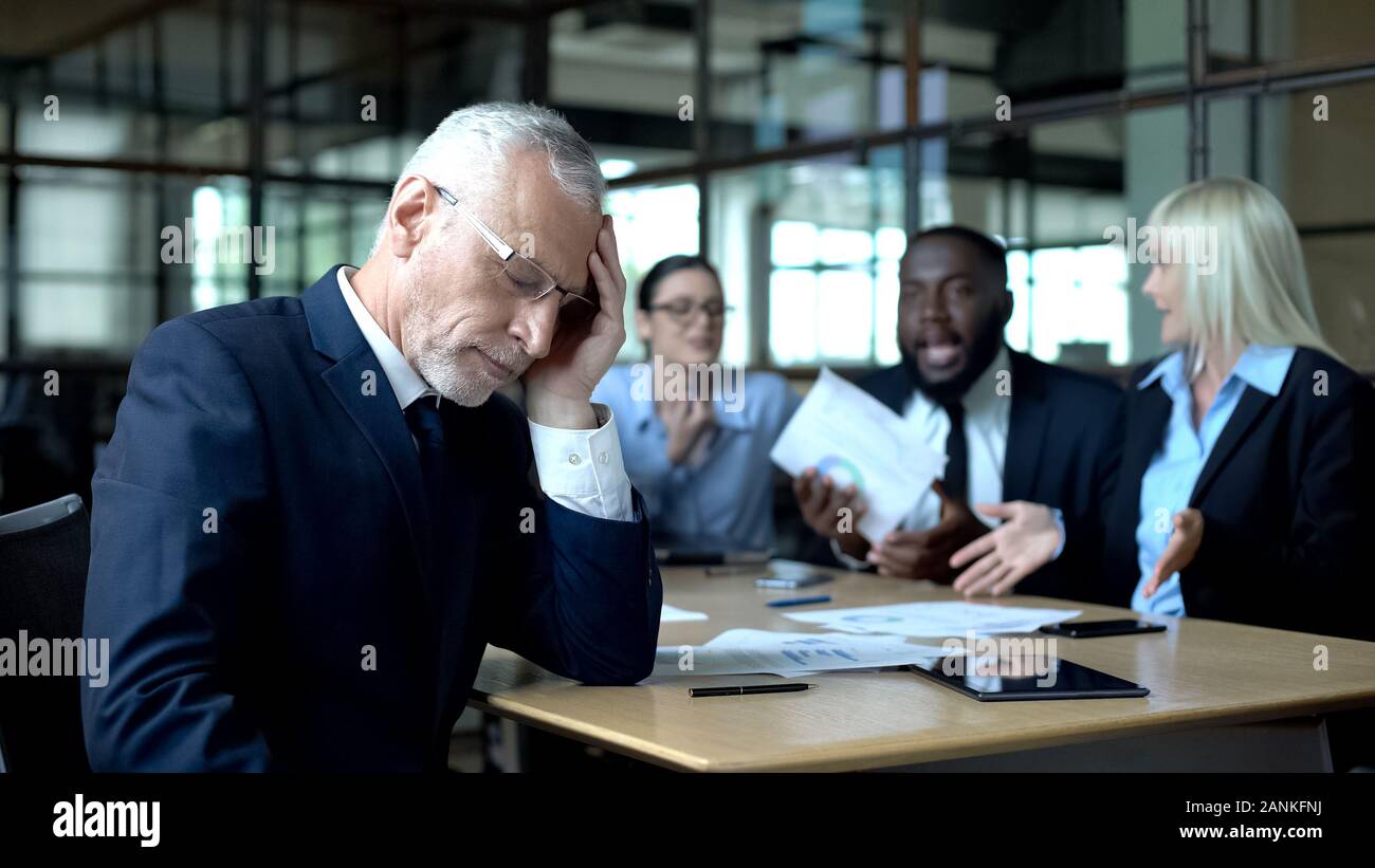Senior manager feeling tired of arguing colleagues office, work stress ...