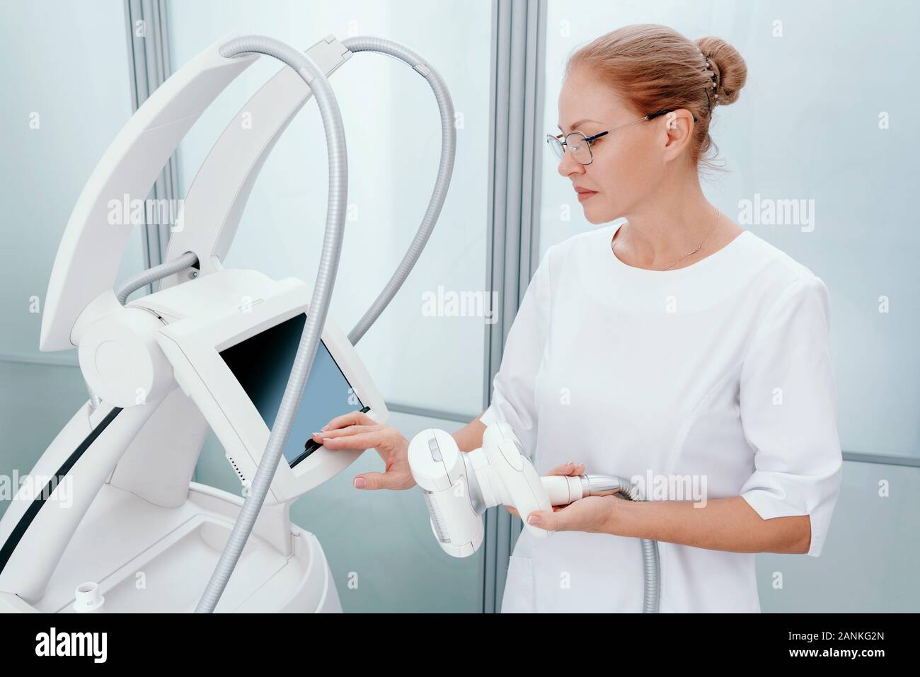 The masseur is preparing to make an hardware massage in a beauty salon ...