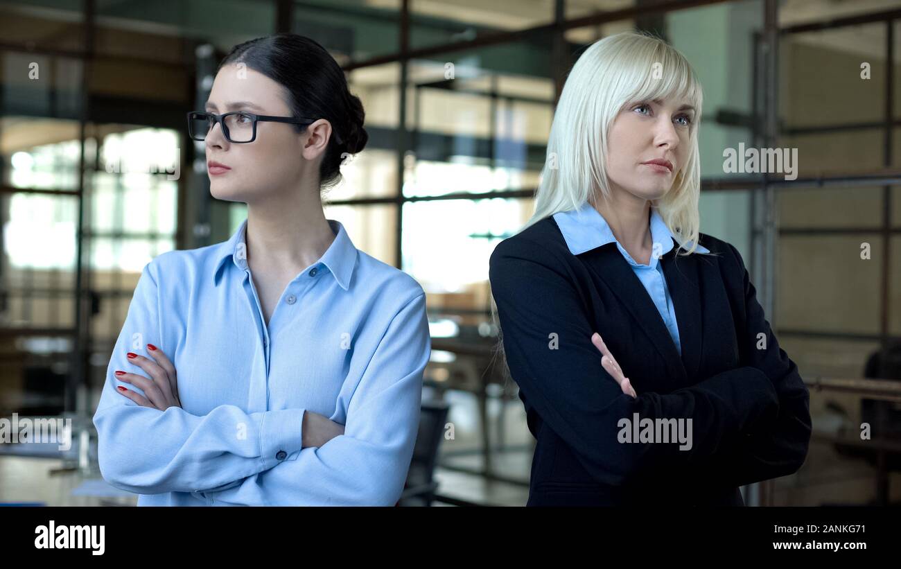 Competing women standing in office, colleagues in conflict, leadership ...