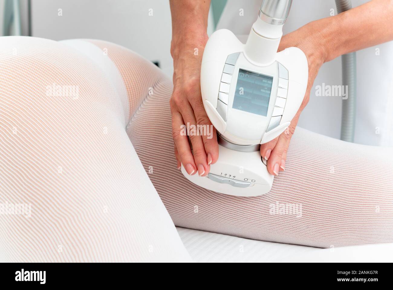 Woman In Special White Suit Getting Anti Cellulite Massage In A Spa