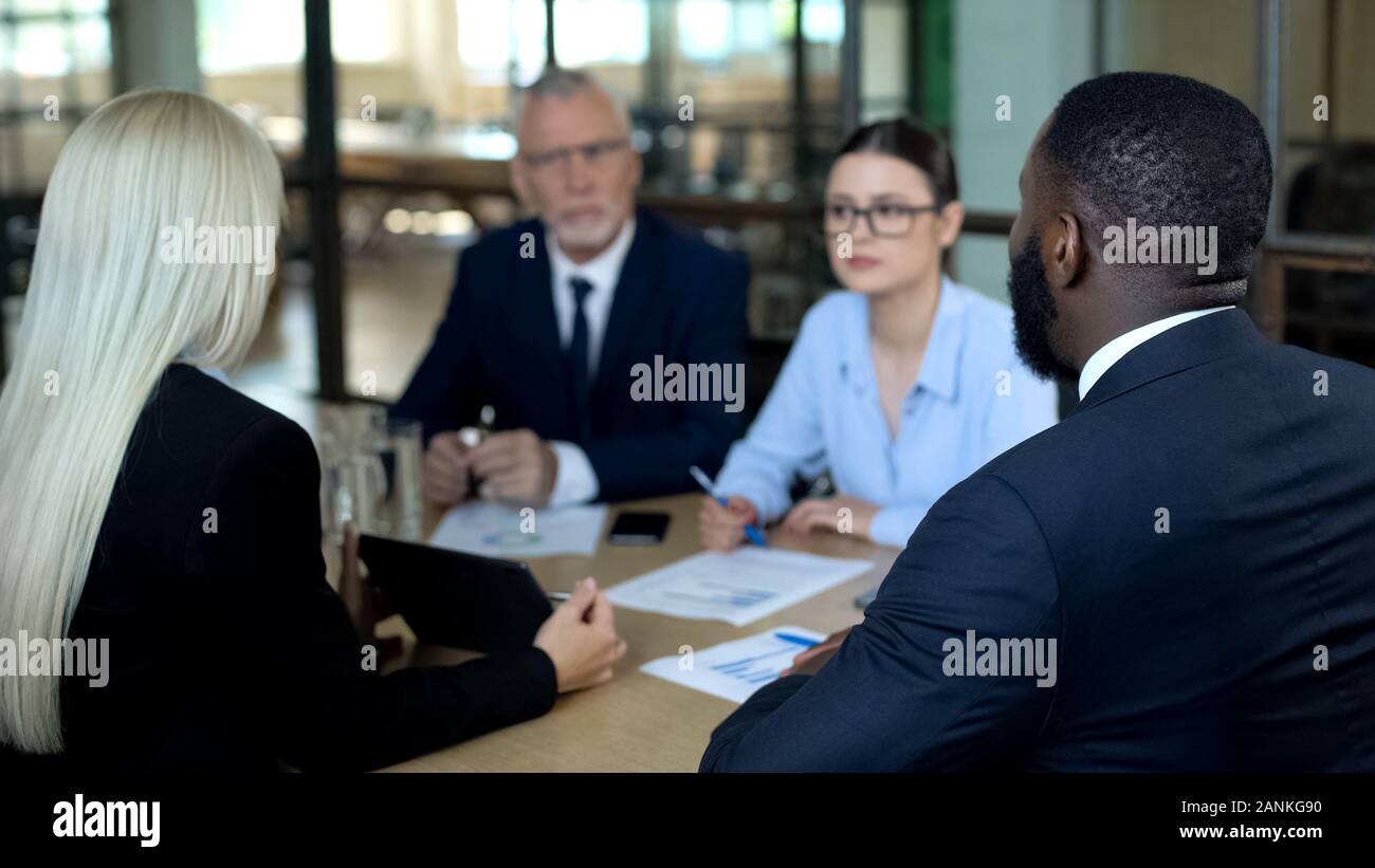 Business partners discussing strategy at office meeting, company ...