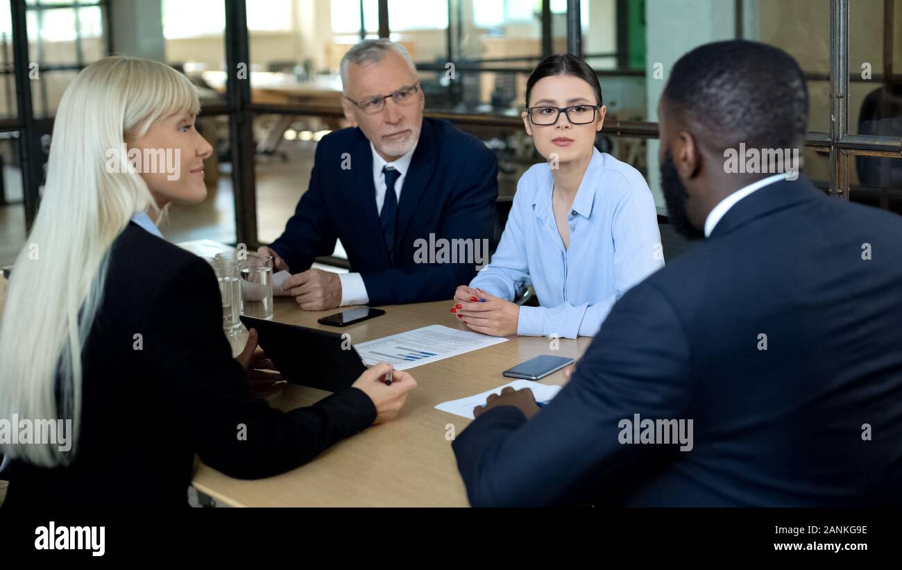 Businesswomen negotiating businessmen hi-res stock photography and ...