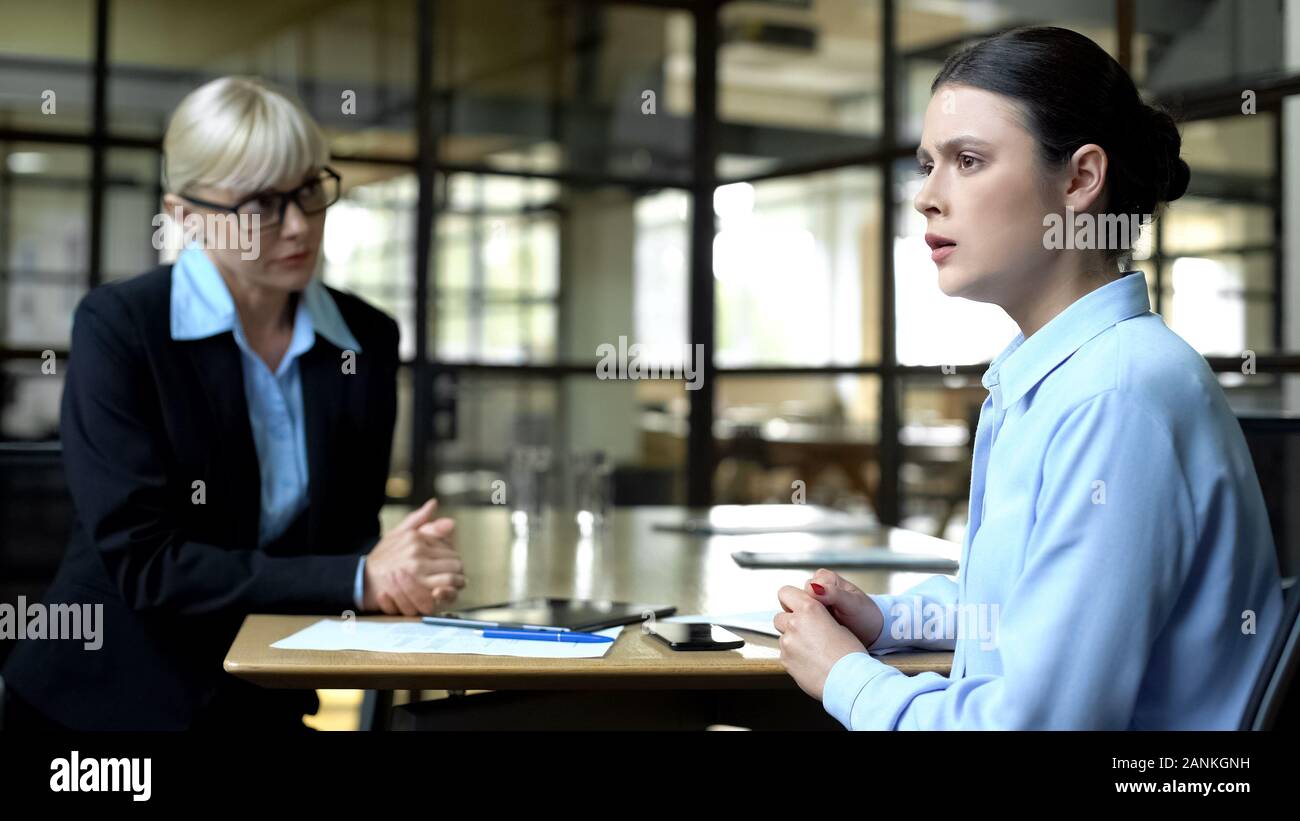 Scared woman at job interview with strict lady boss, business career ...