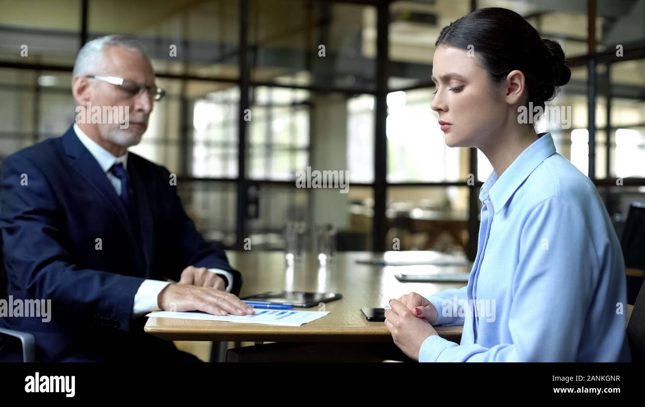 Strict old boss criticizing young female employee, career development ...