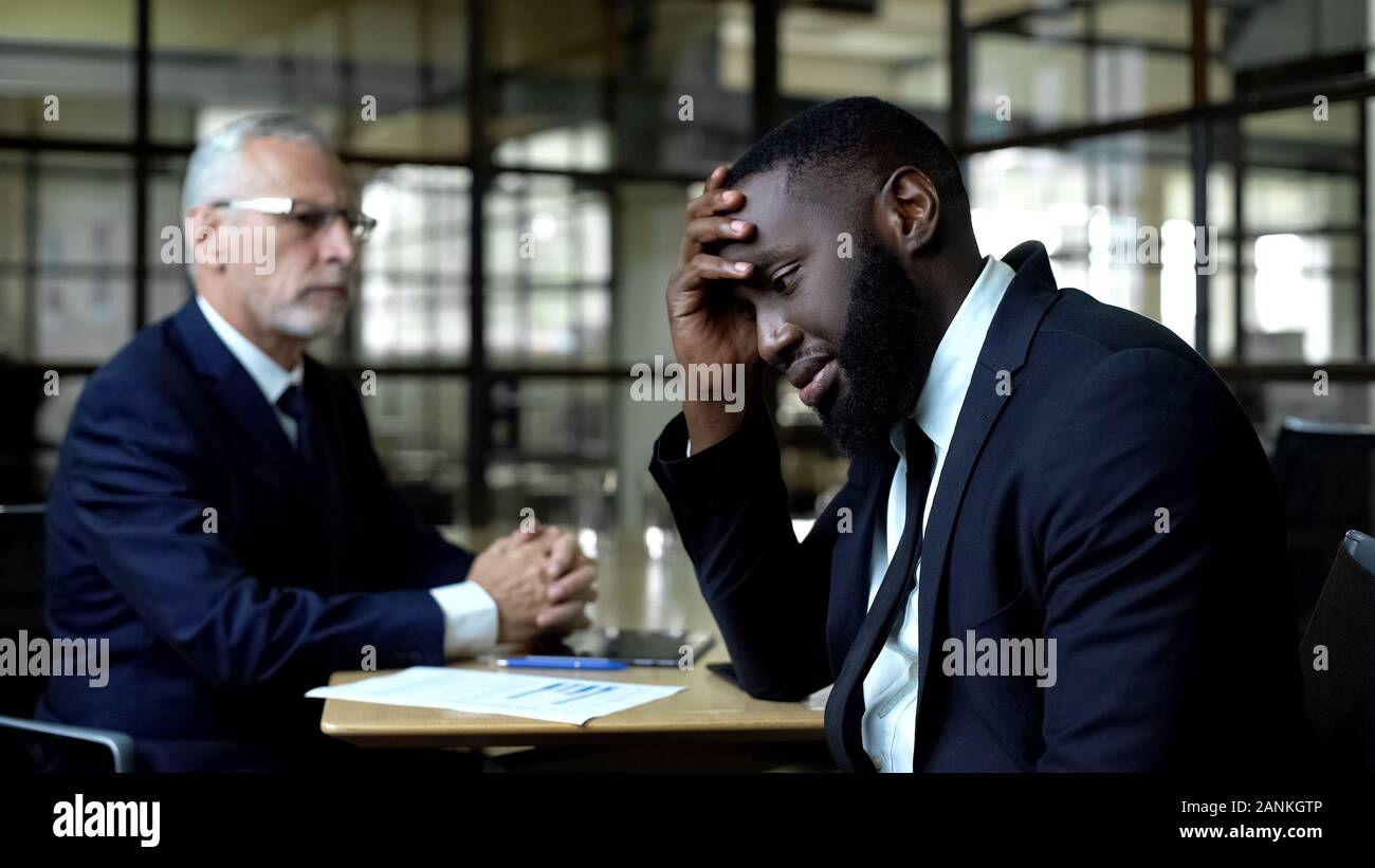 Mature business man refusing black job candidate, interview failure ...