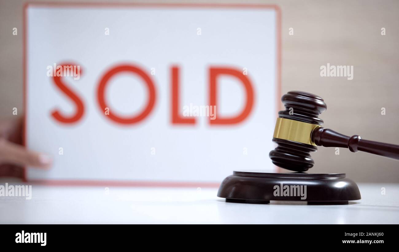 Gavel standing sound block against sold sign background, court decision ...