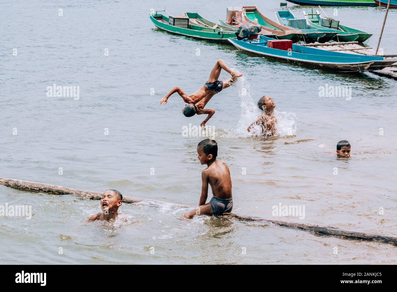 Boy Swimming In River
