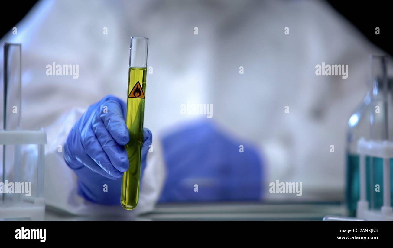 Scientist examining test tube flammable hi-res stock photography and ...