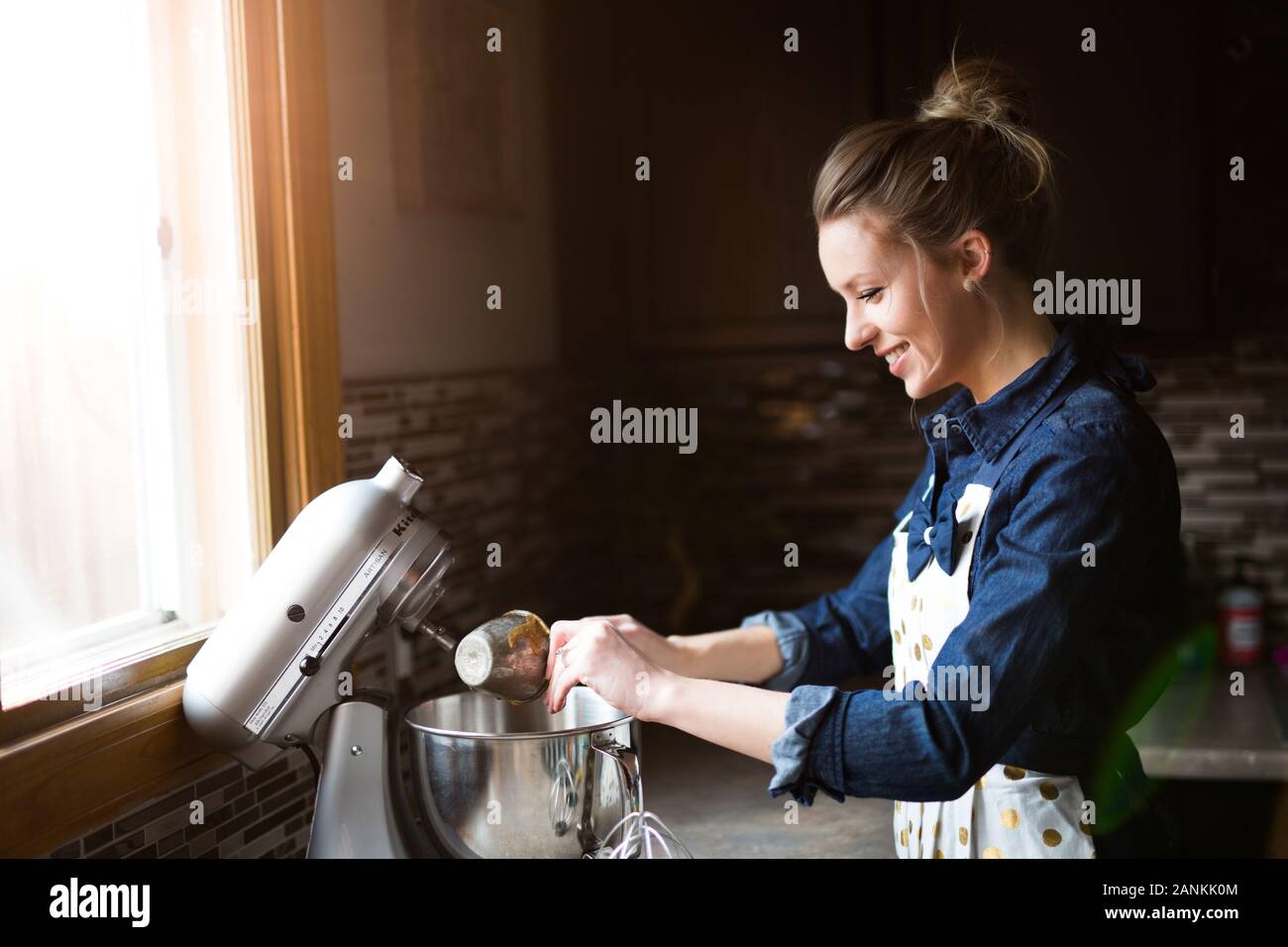 Beautiful blonde woman cooking hi-res stock photography and images - Alamy