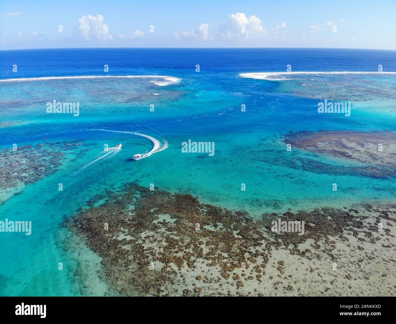 Aerial view of shades of blue and coral reefs over the Moorea lagoon in ...