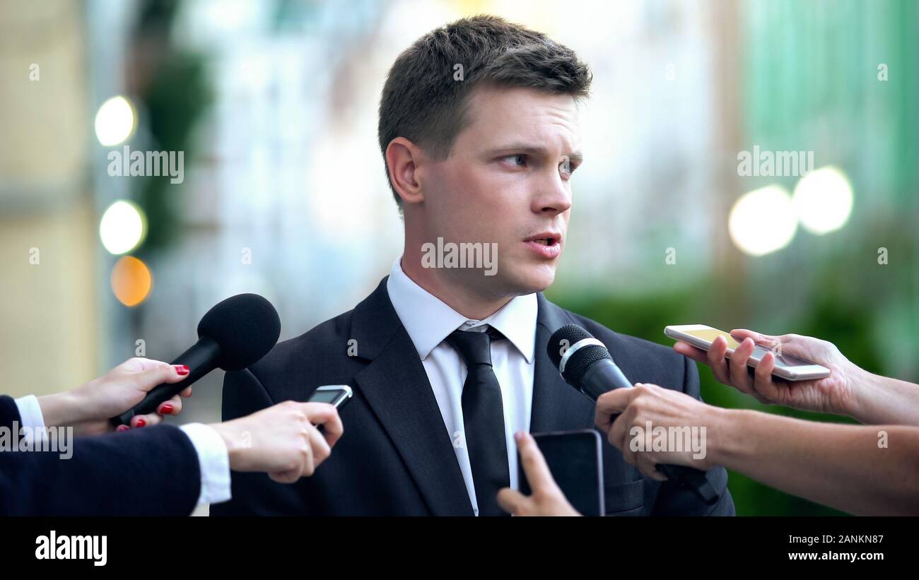Politician giving live interview reporters hi-res stock photography and ...