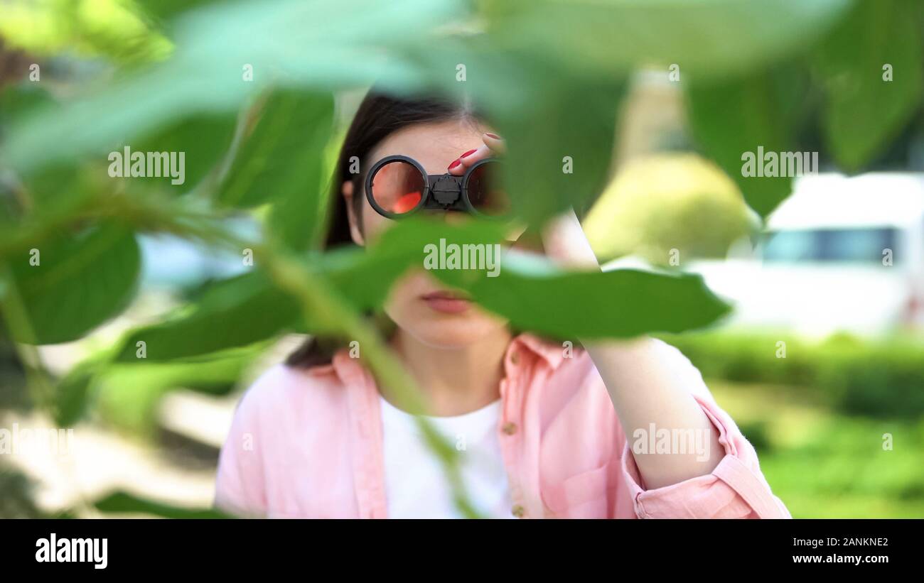 Hiding behind newspaper hi-res stock photography and images - Alamy