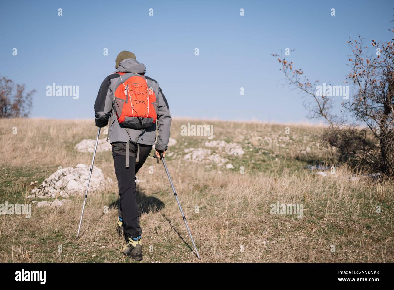 Man wearing backpack climbing mountain hi-res stock photography and ...