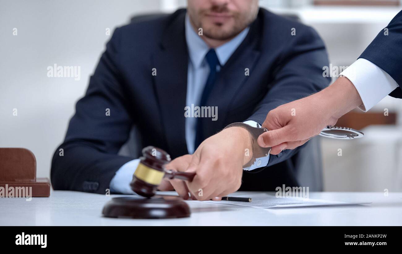Handcuffing hi-res stock photography and images - Alamy