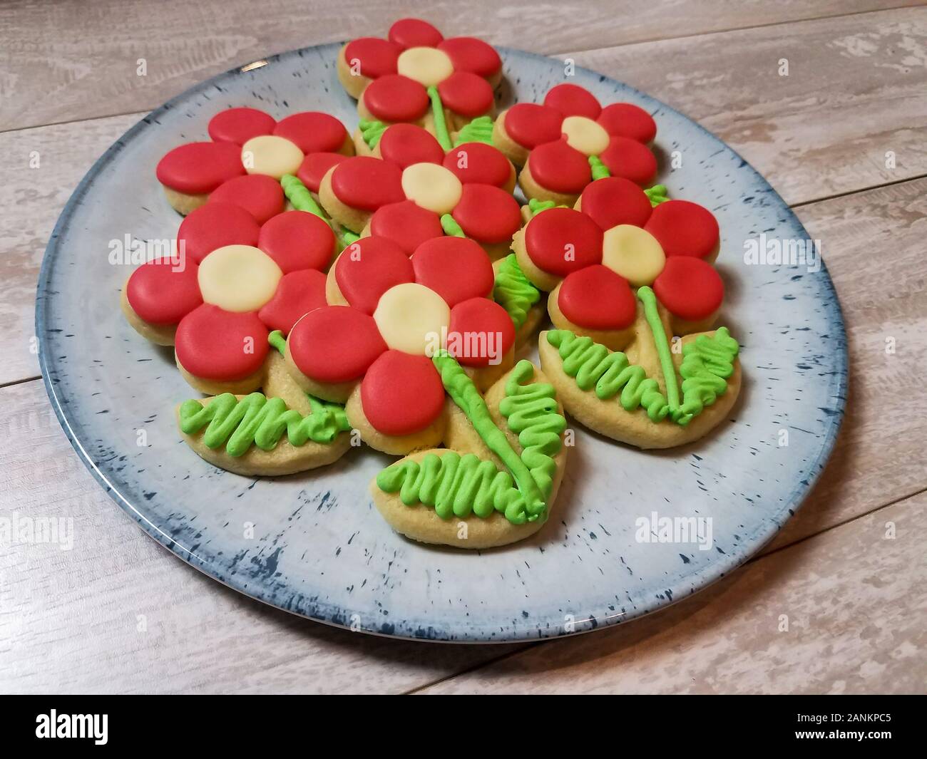 Abstract red flower cookies outlined with thick royal icing Stock Photo ...
