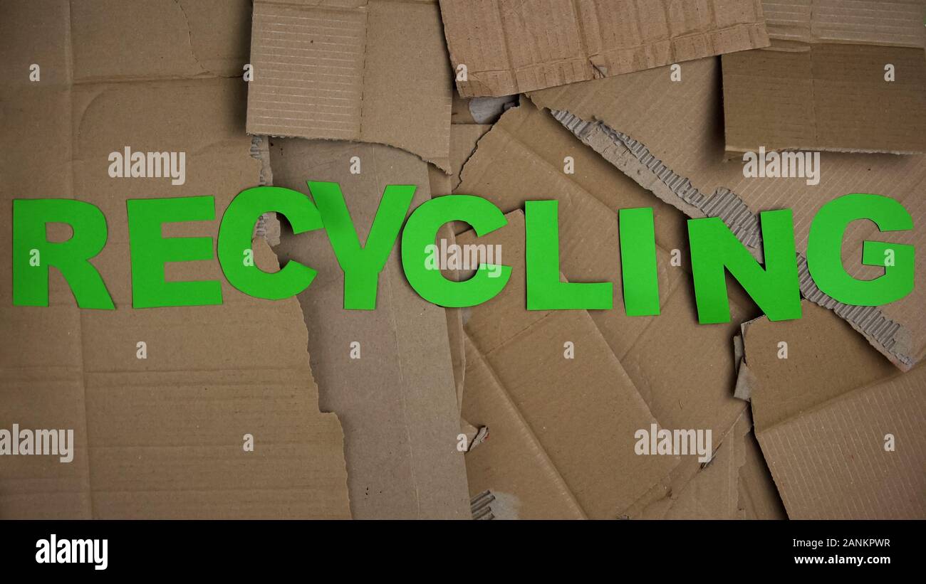 Recycling word made of green letters on cardboard background, save ...