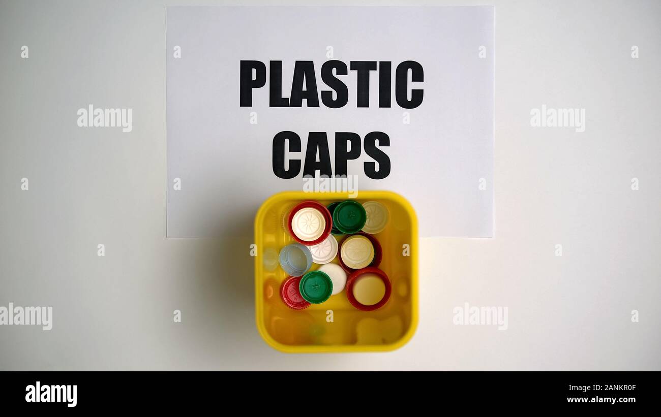 Plastic caps phrase written, container with it standing by, conscious ...