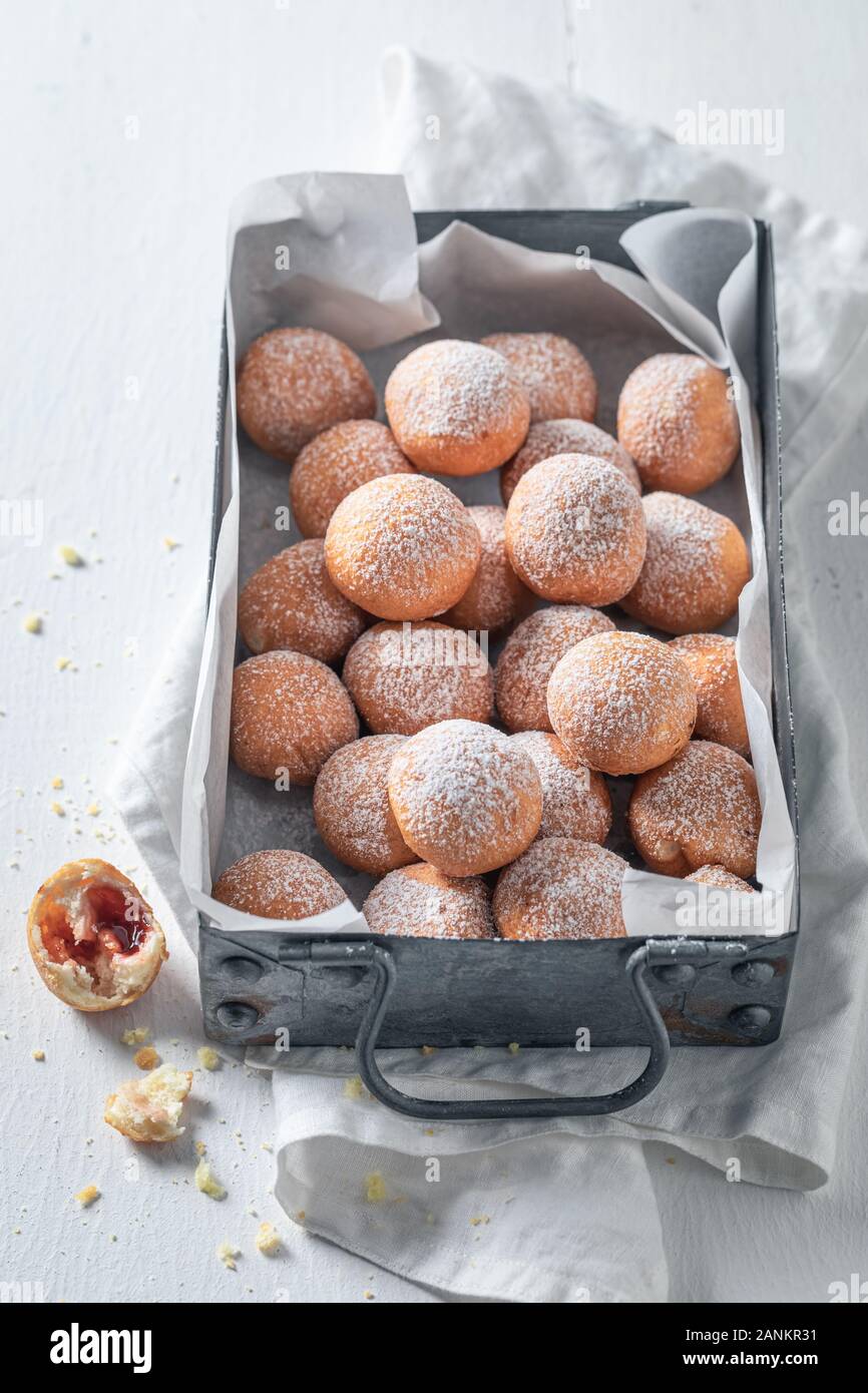 Delicious and homemade donut balls freshly baked Stock Photo - Alamy