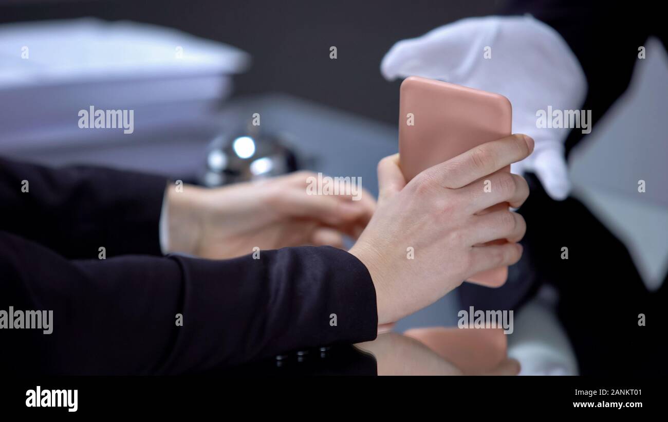Nervous man ringing hotel reception hi-res stock photography and images ...