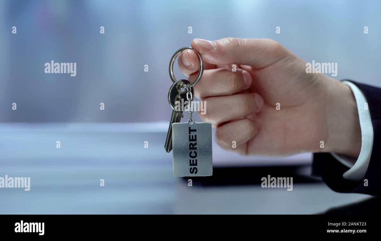 Hand demonstrating keychain, conspiracy, providing data protection ...