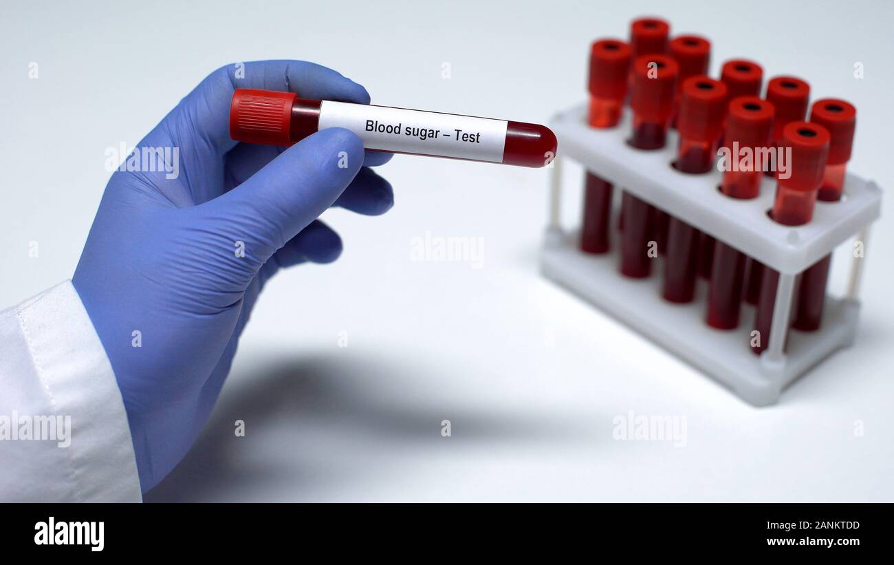 Blood sugar test, doctor showing blood sample tube, disease prevention ...