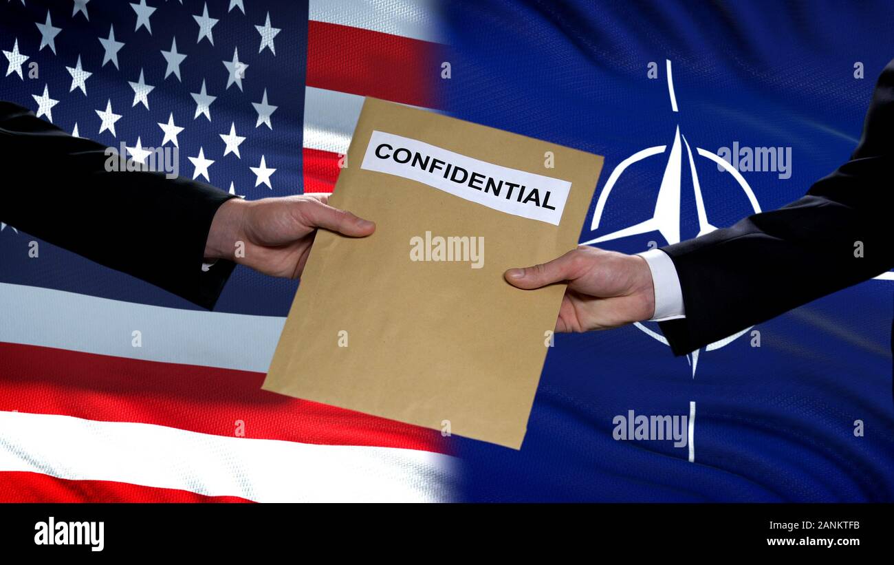 USA and NATO officials exchanging confidential envelope, flags ...