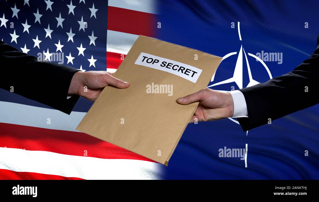 USA and NATO politicians exchanging top secret envelopes, flags ...