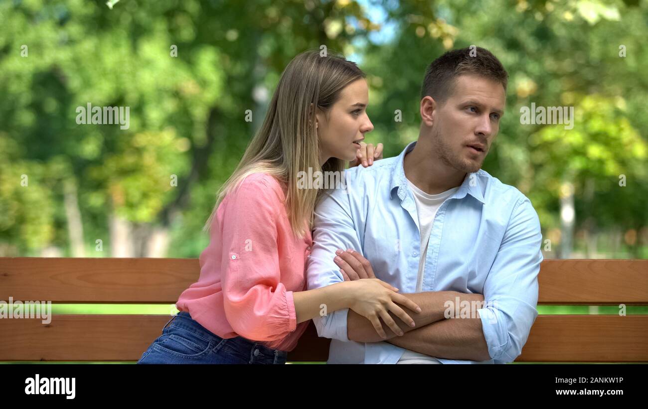 Apologizing woman hugging offended man, reconciliation attempt, couple ...