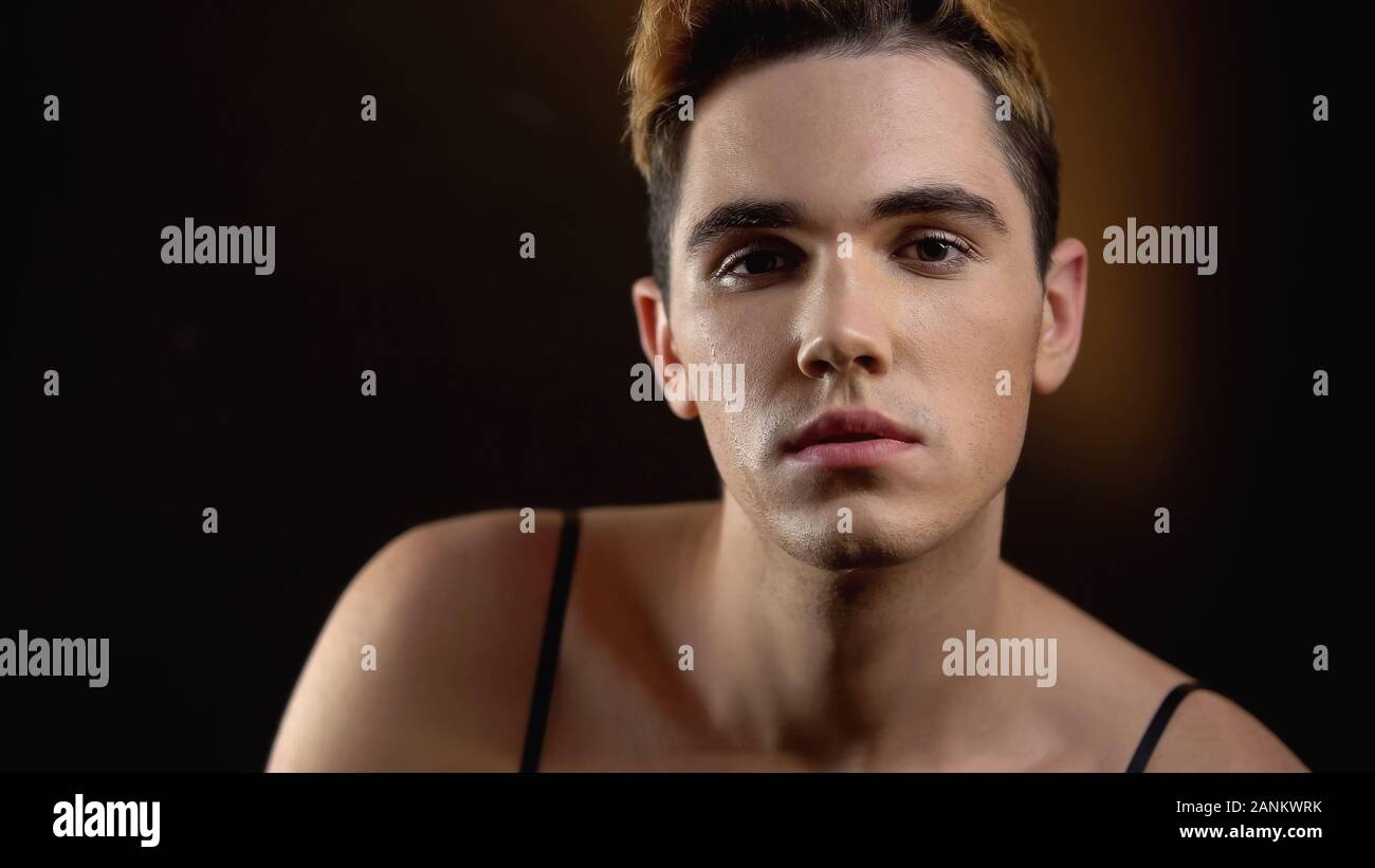 Seductive male transgender in female dress looking at camera, lgbt ...