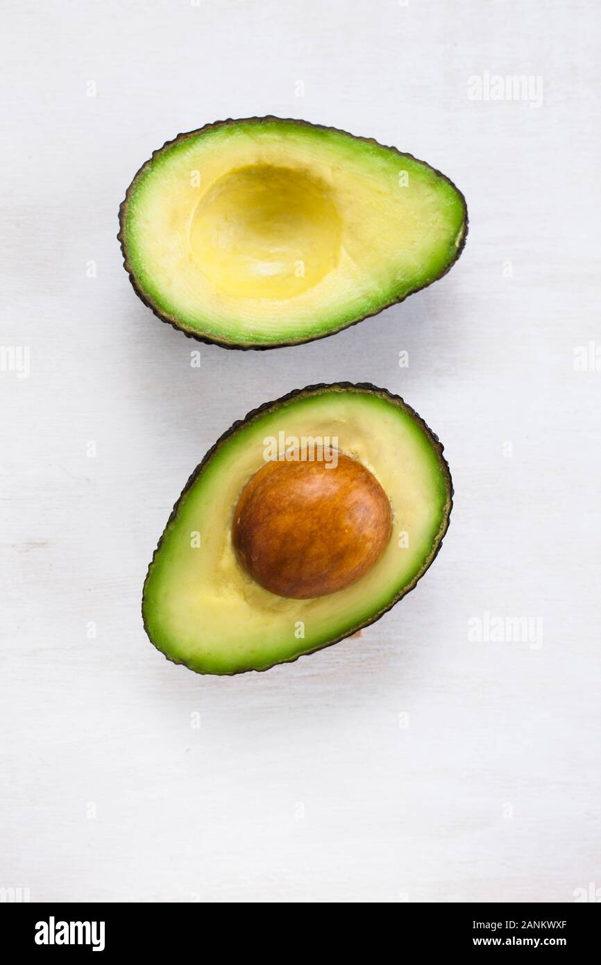 An avocado cut in half Stock Photo - Alamy