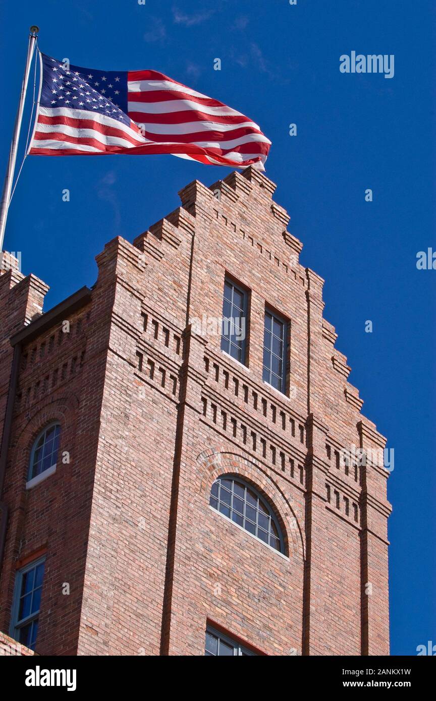 Old building flying the American flag Stock Photo - Alamy