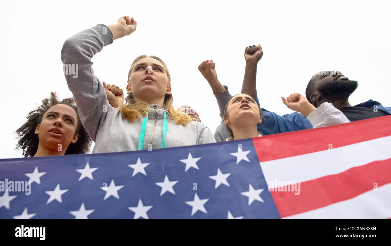 Activists chanting nationalist slogans holding US flag, democratic ...