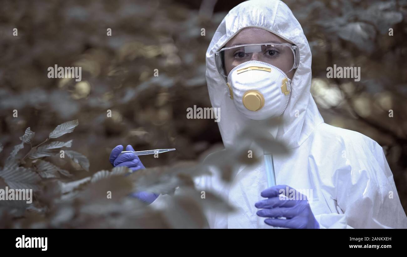 Chemist analyzing infected water sample zone of alienation, radioactive ...