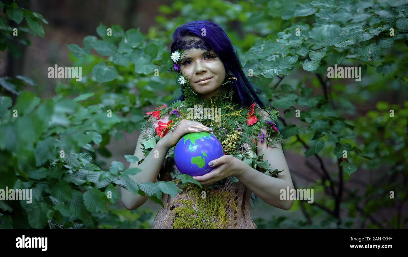 Earth mother holding planet in hands, environmental protection, nature ...