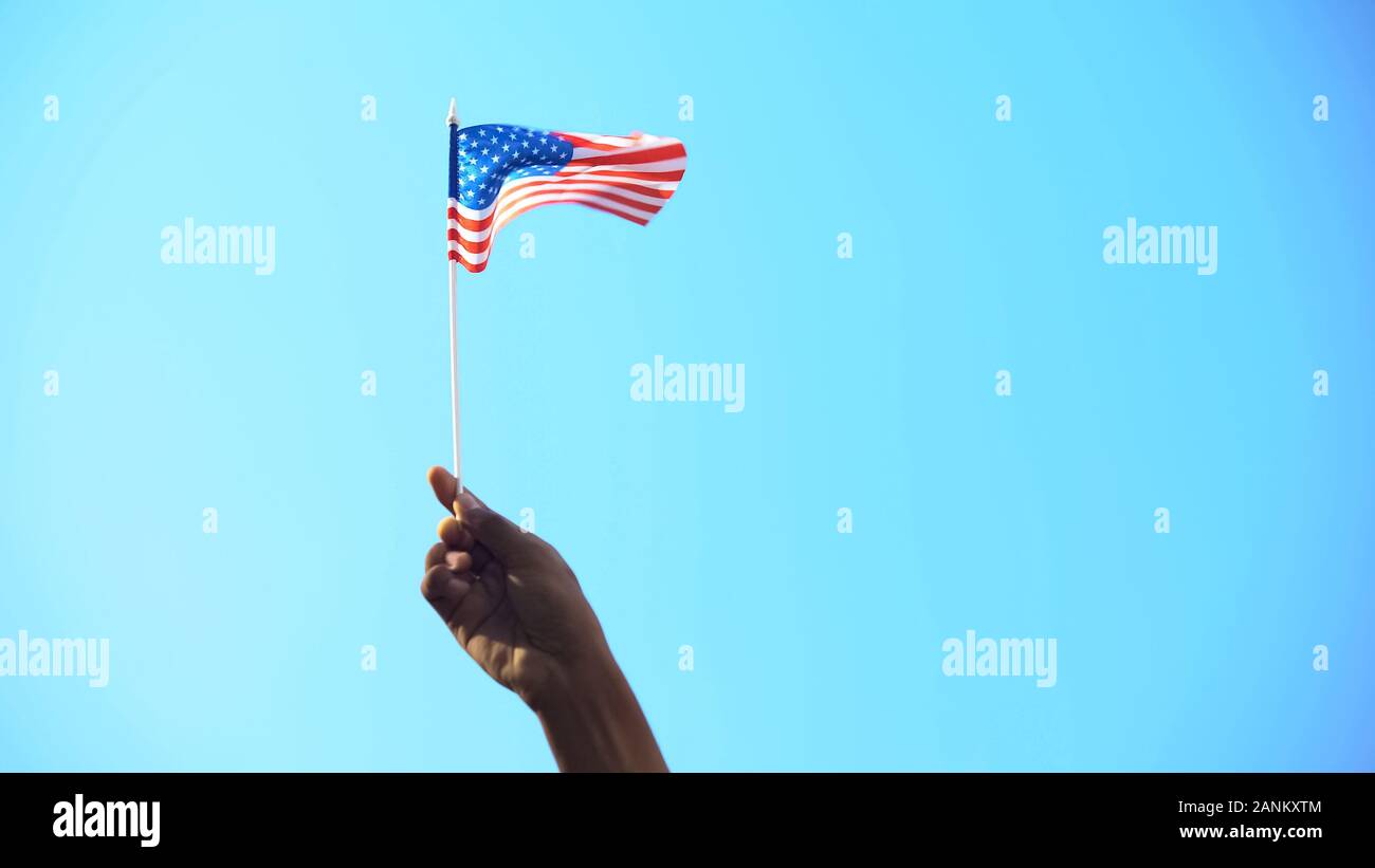 Person holding flag hi-res stock photography and images - Alamy