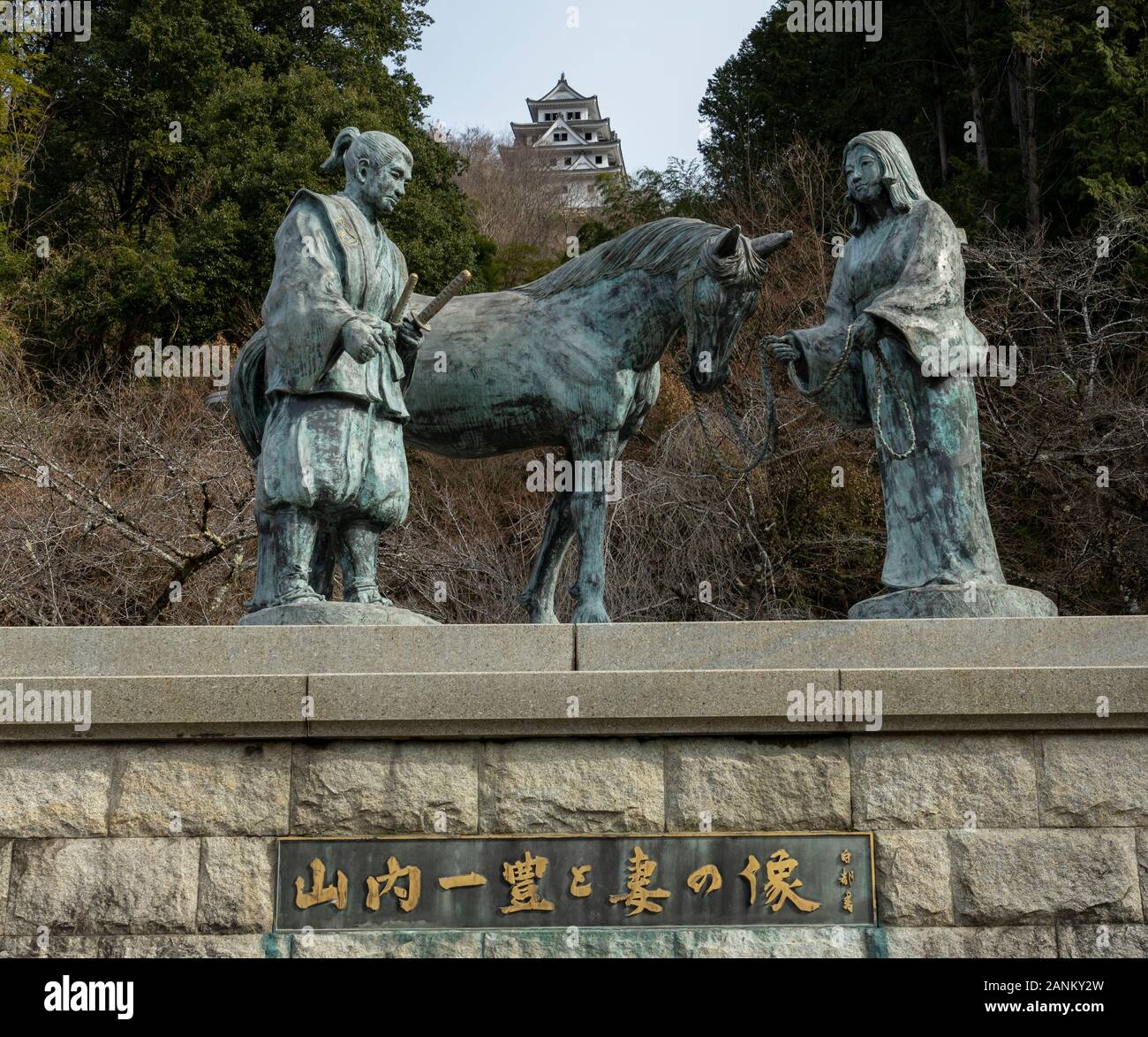 Statues of Kazutoyo and Chiyo with a horse below Gujo-Hachiman Castle ...