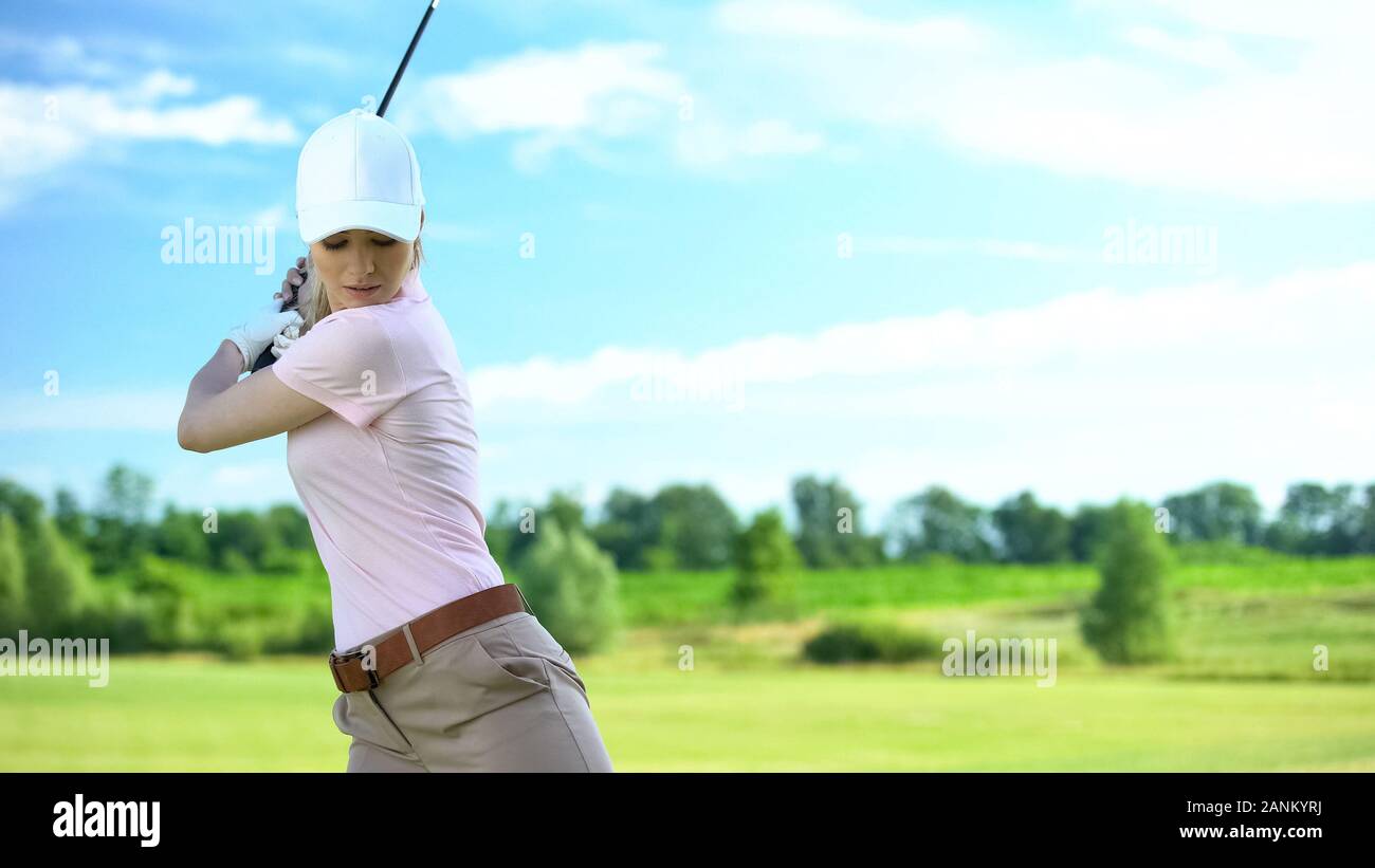 Female golfer hitting ball hi-res stock photography and images - Alamy
