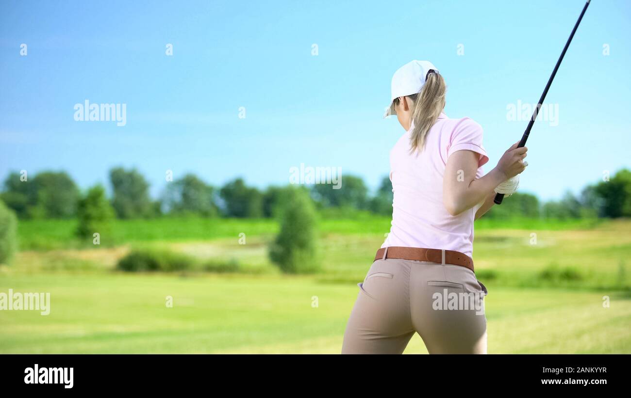 Female golfer hitting ball hi-res stock photography and images - Alamy