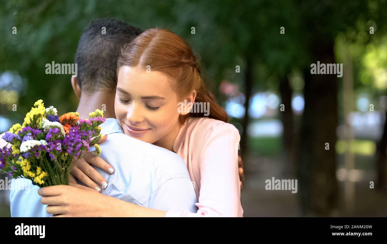 Teenager hugging flowers hi-res stock photography and images - Alamy