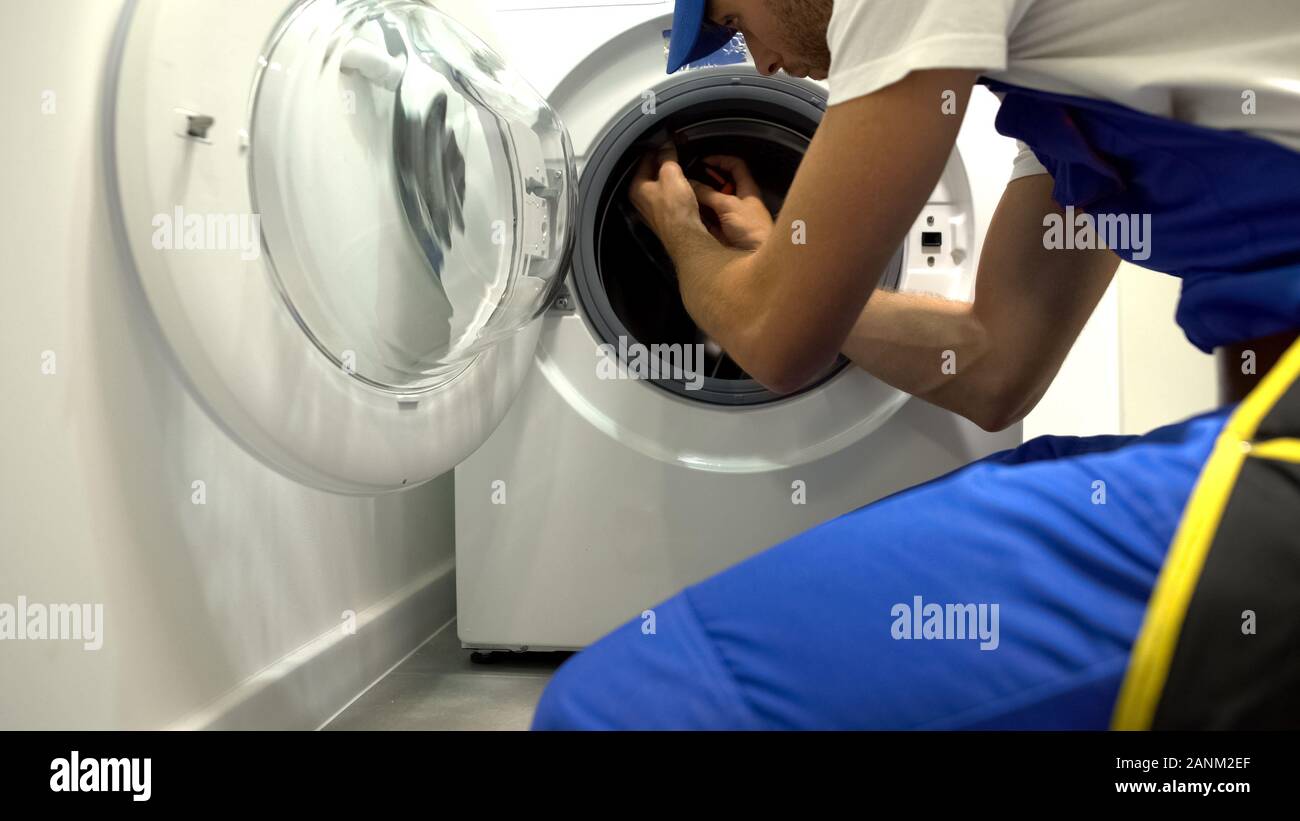 Repairing washing machine hi-res stock photography and images - Alamy