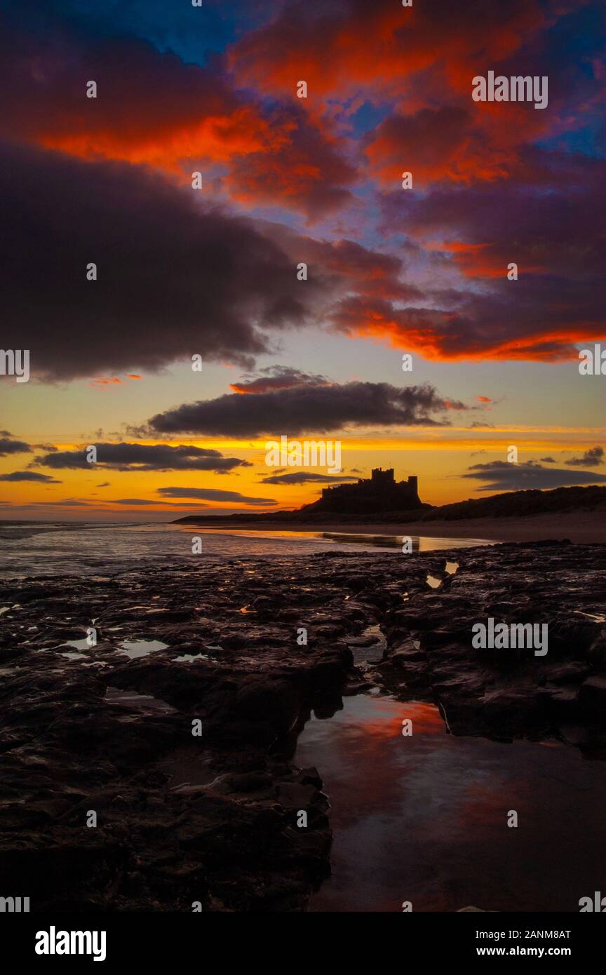 Winter sunrise over Bamburgh Castle one of the most iconic castle views ...
