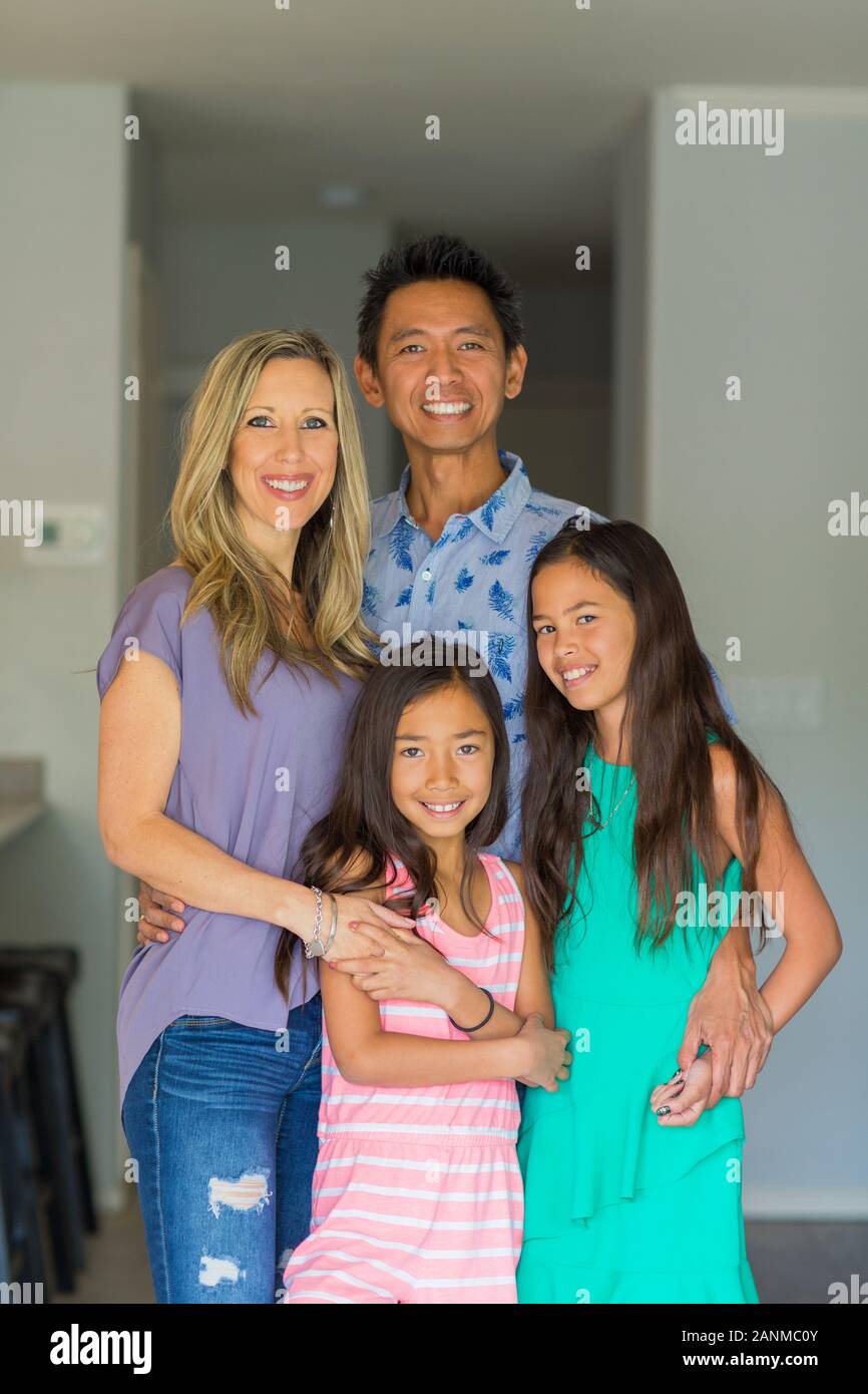 Portrait of a happy mixed race family Stock Photo - Alamy